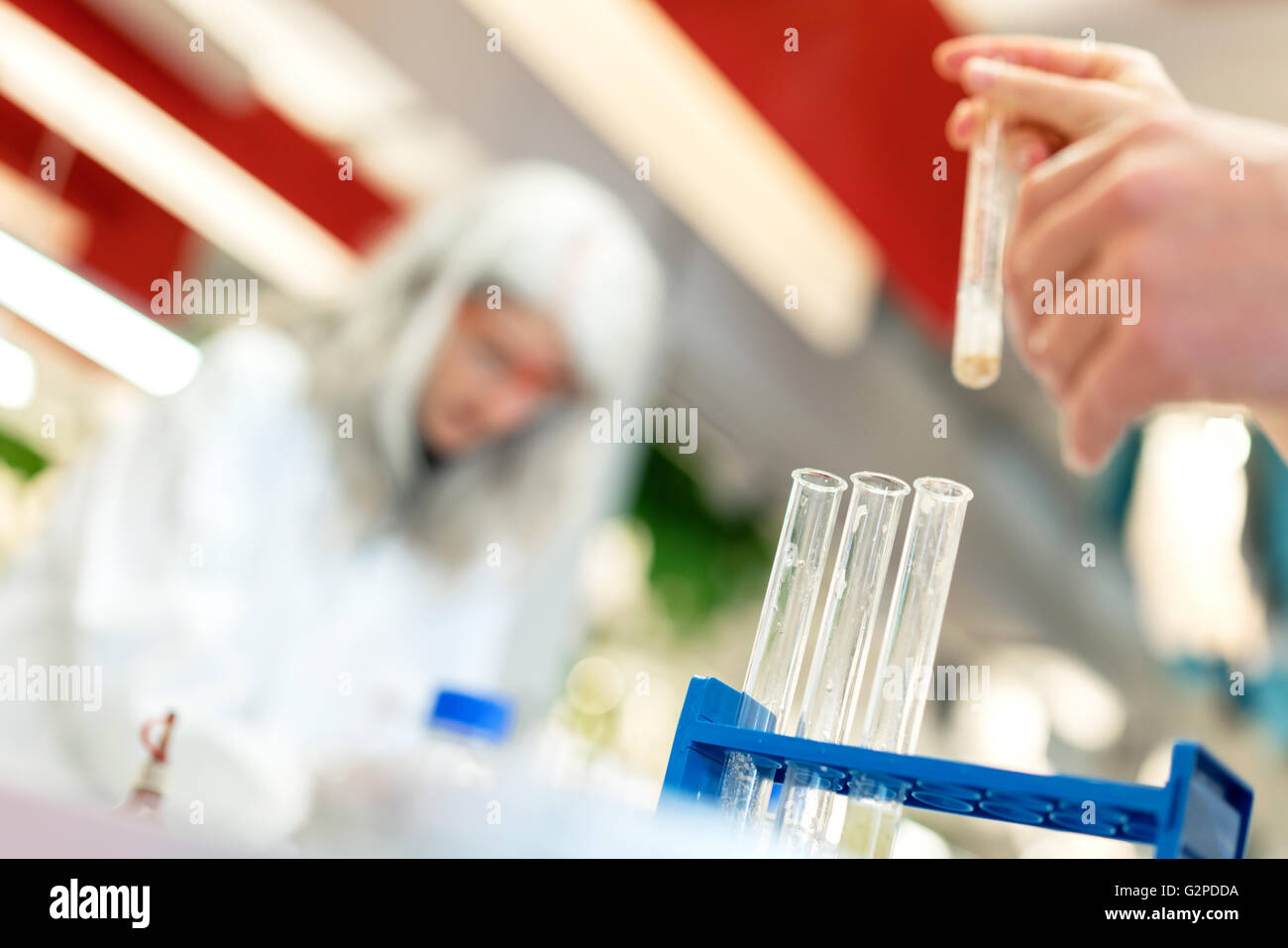 Pictures who made in a laboratory shows some people who made tests and ...
