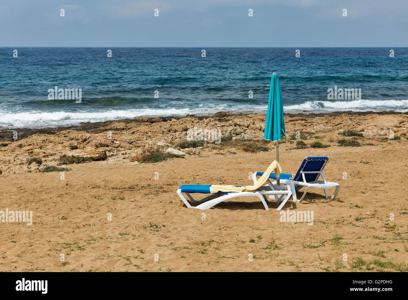 Wooden sunbeds and umbrella for relaxation on the Mediterranean sea ...