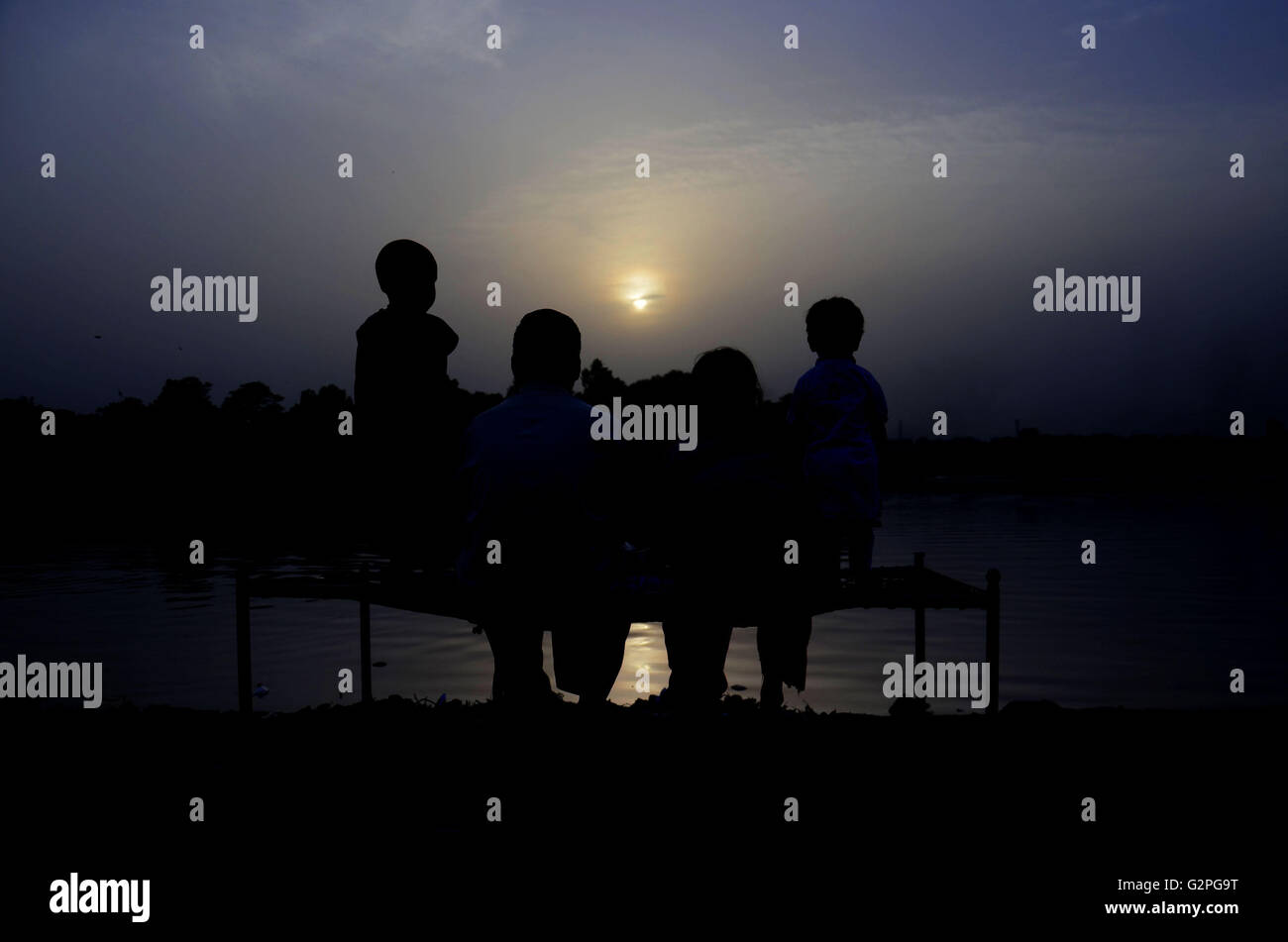 Lahore, Pakistan. 01st June, 2016. Pakistani parents with their ...