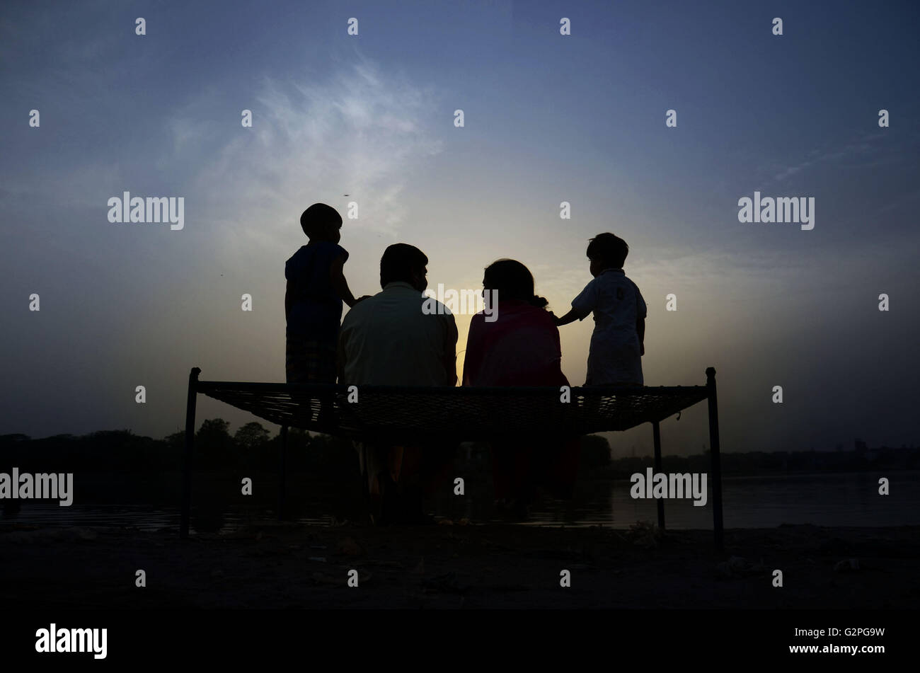 Lahore, Pakistan. 01st June, 2016. Pakistani parents with their ...