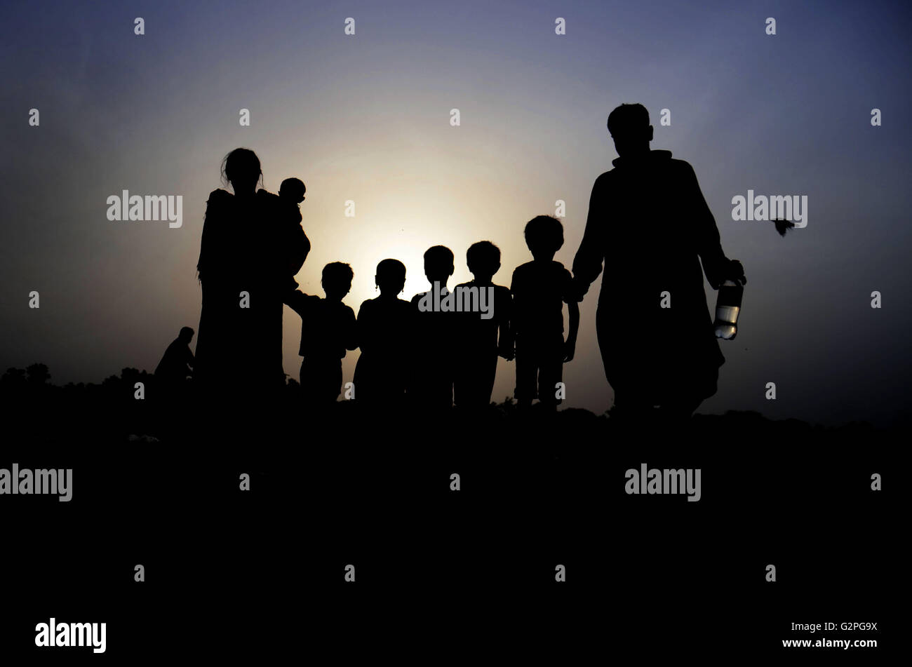 Lahore, Pakistan. 01st June, 2016. Pakistani parents with their ...