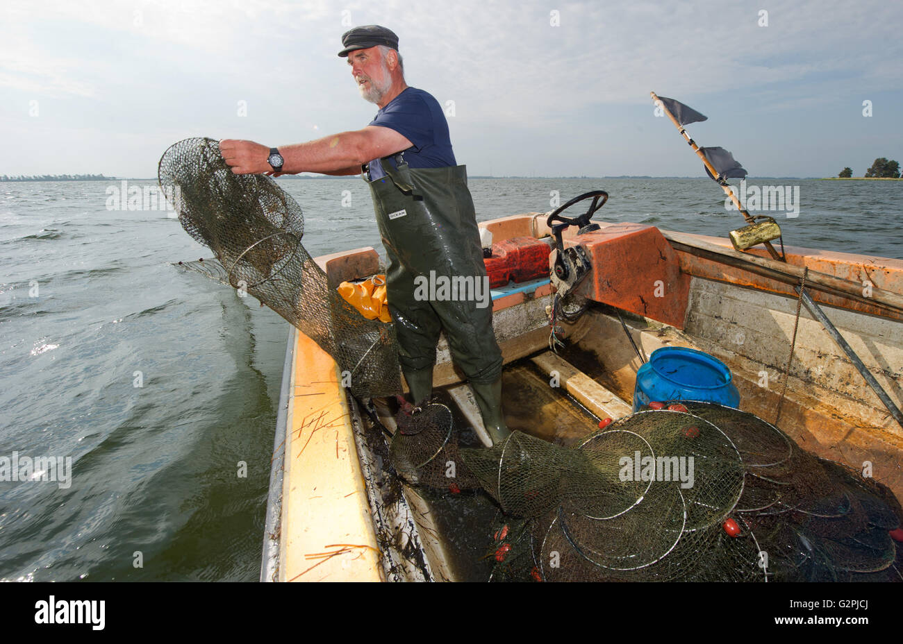 Ruegen, Germany. 31st May, 2016. Juergen Krieger stands on his fishing ...