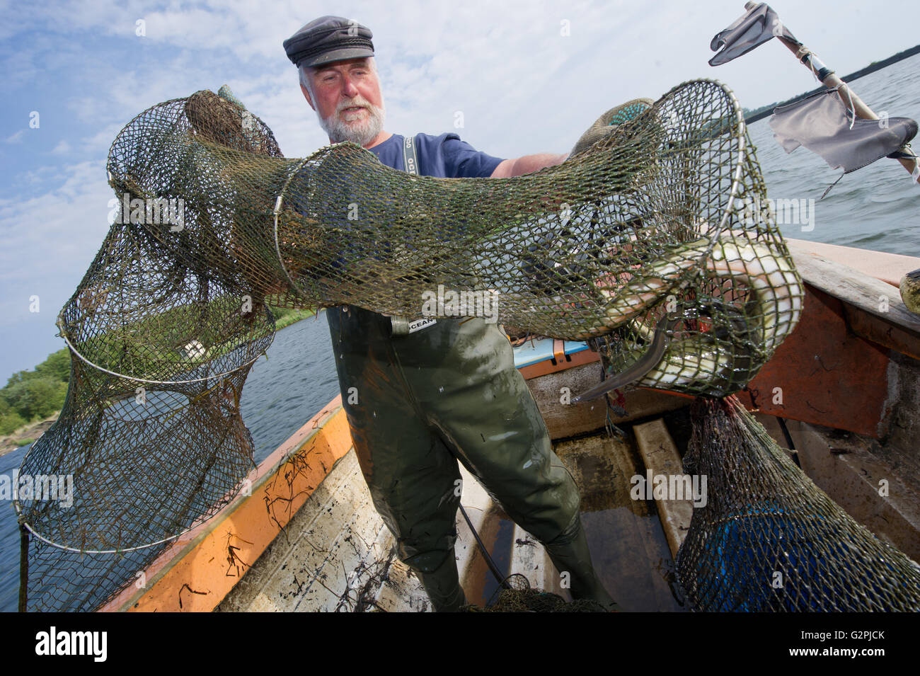 Ruegen, Germany. 31st May, 2016. Juergen Krieger stands on his fishing ...