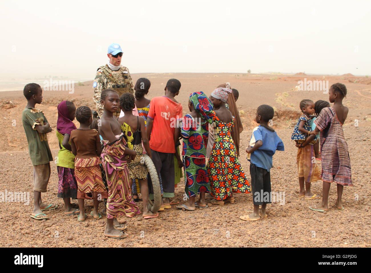 Gao, Mali. 7th May, 2016. A German UN soldier speaking to children ...
