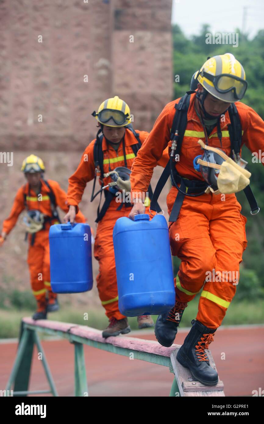 Xiamen, China's Fujian Province. 2nd June, 2016. Firefighters cross ...