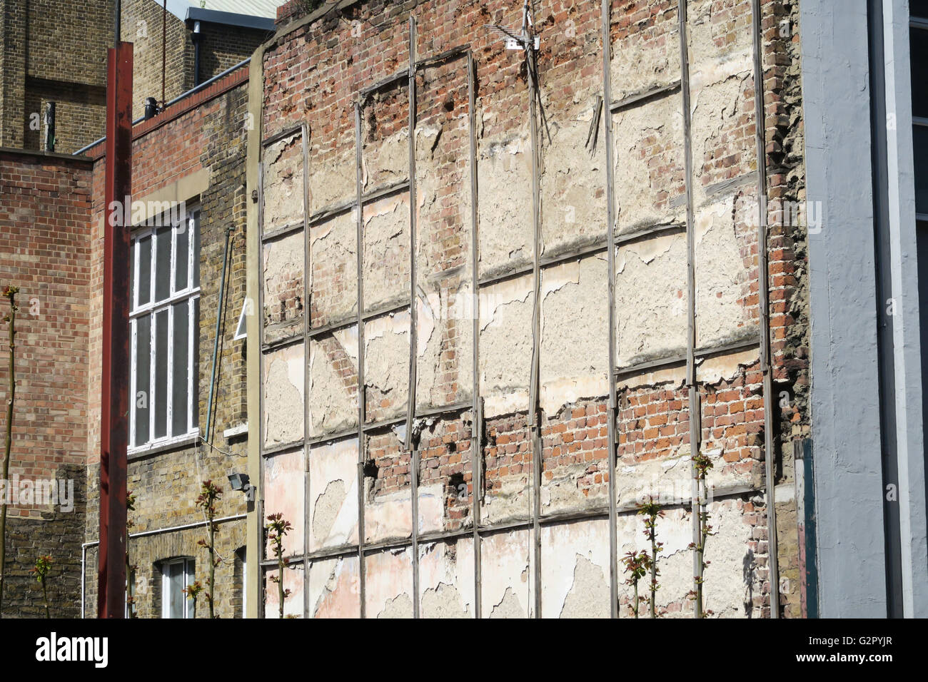 old brick advertising/rear of housing block being redeveloped Stock ...