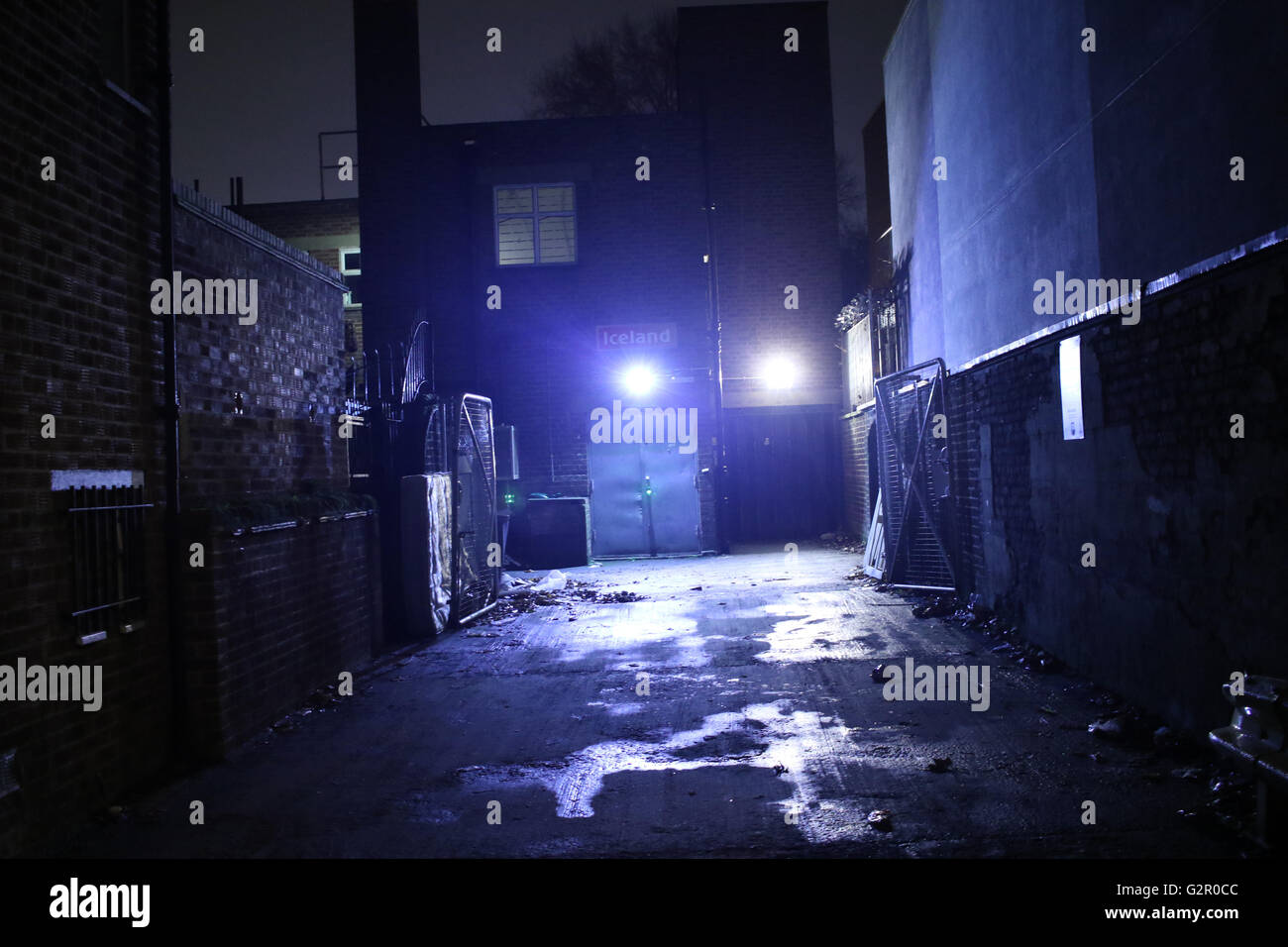 colorfully lit side alley / commercial loading bay Stock Photo - Alamy