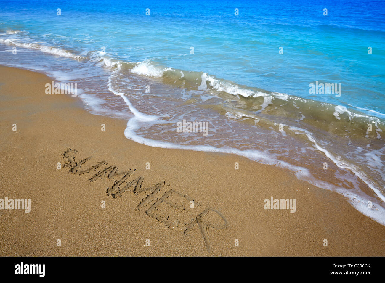 Summer spell written word in sand of a beach in vacation Stock Photo ...
