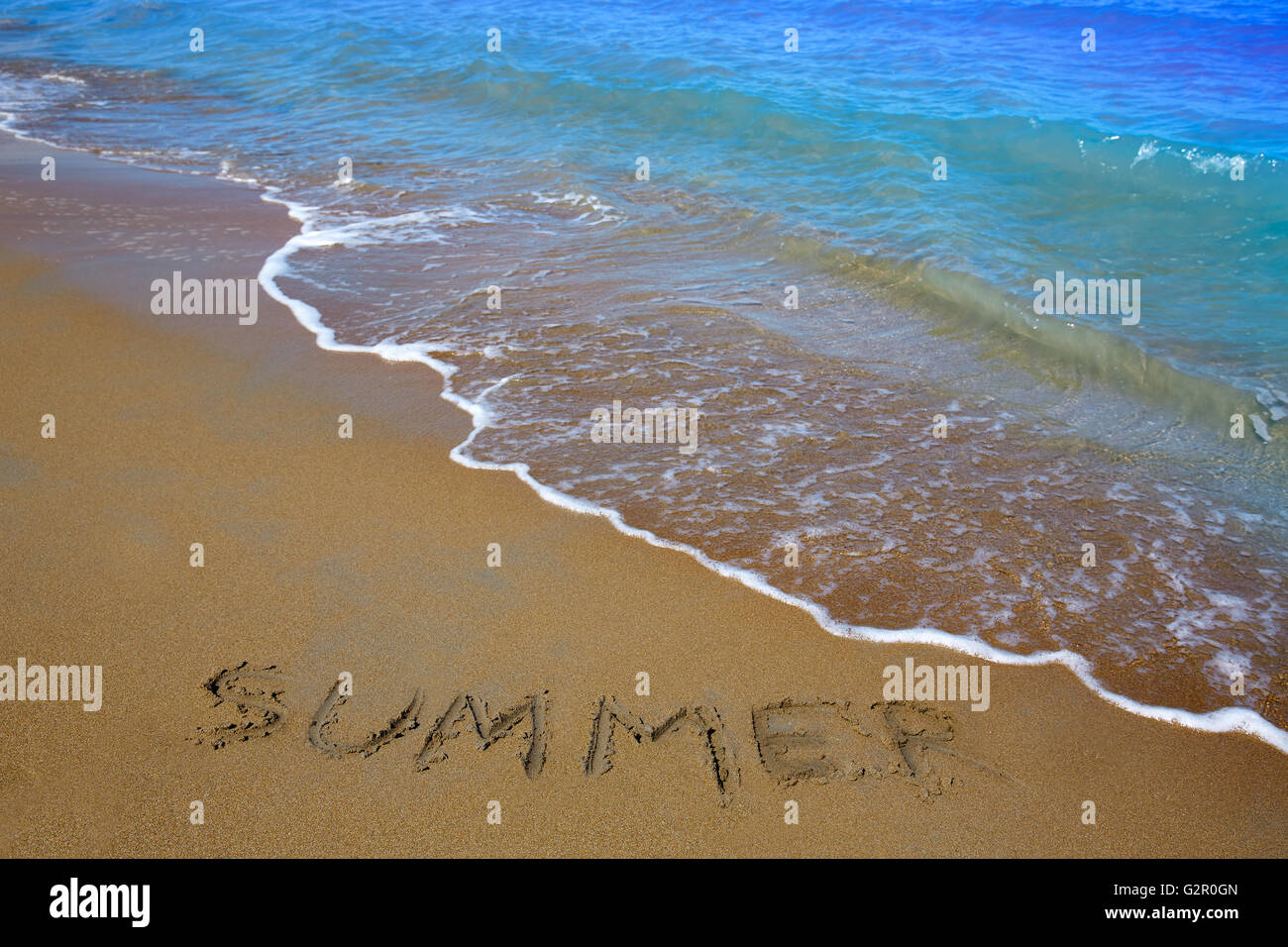 Summer spell written word in sand of a beach in vacation Stock Photo ...