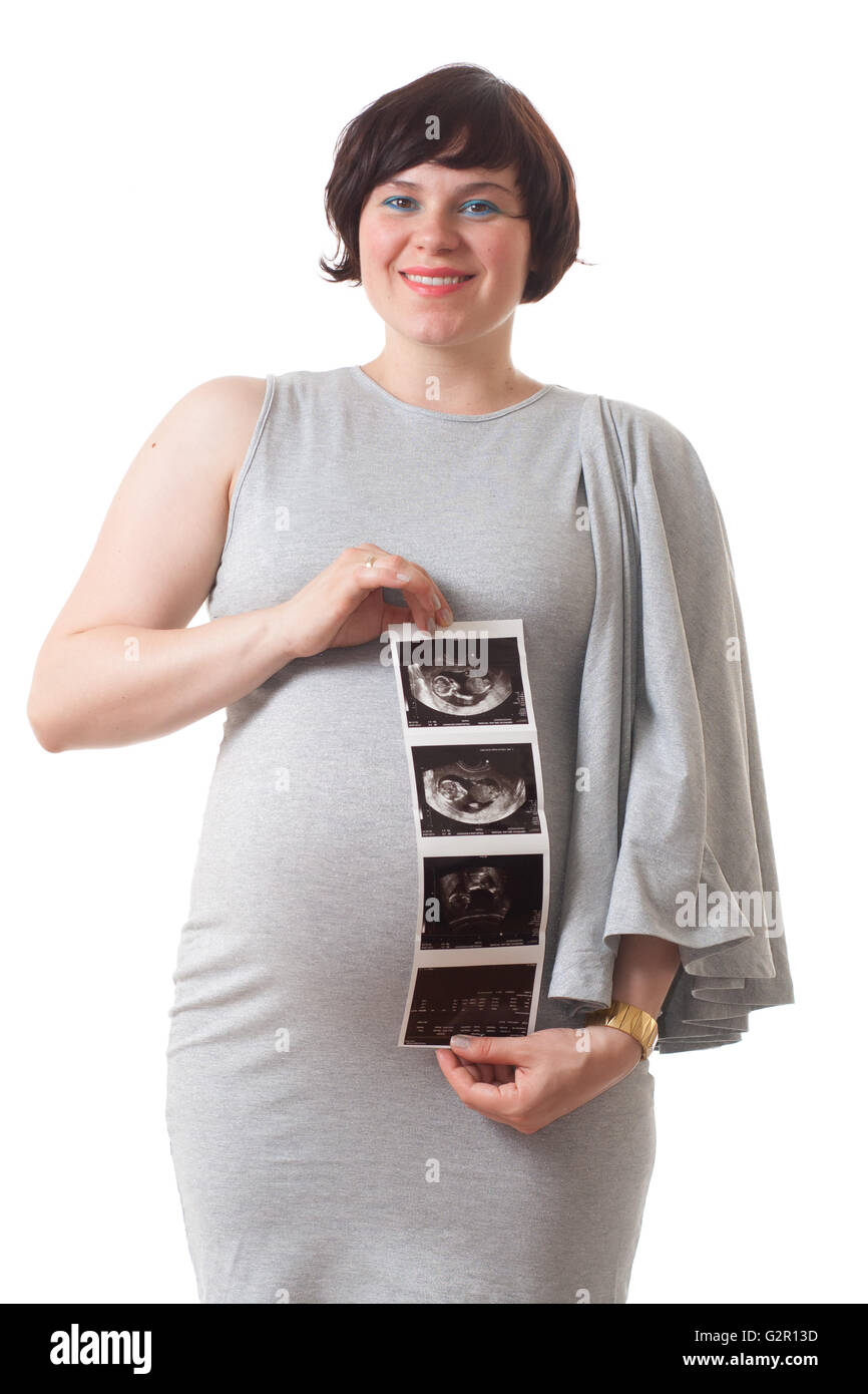Pregnant woman holding fetus ultrasound image. White isolated ...