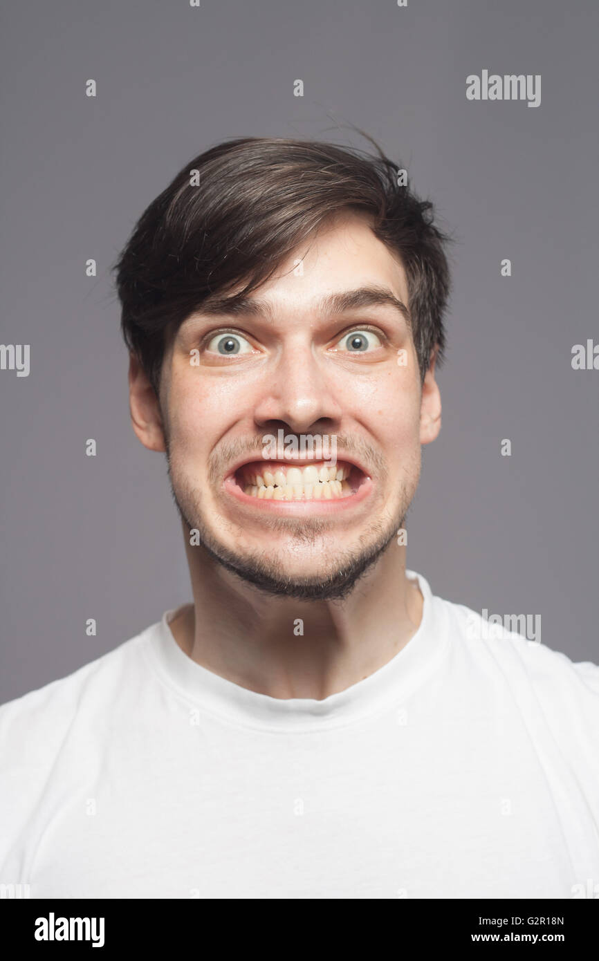 Crazy portrait, funny face showing teeth Stock Photo - Alamy