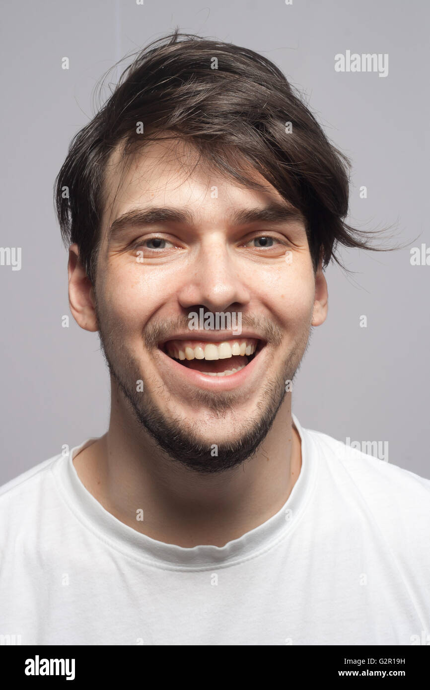 Silly smiling portrait, hair flying Stock Photo - Alamy