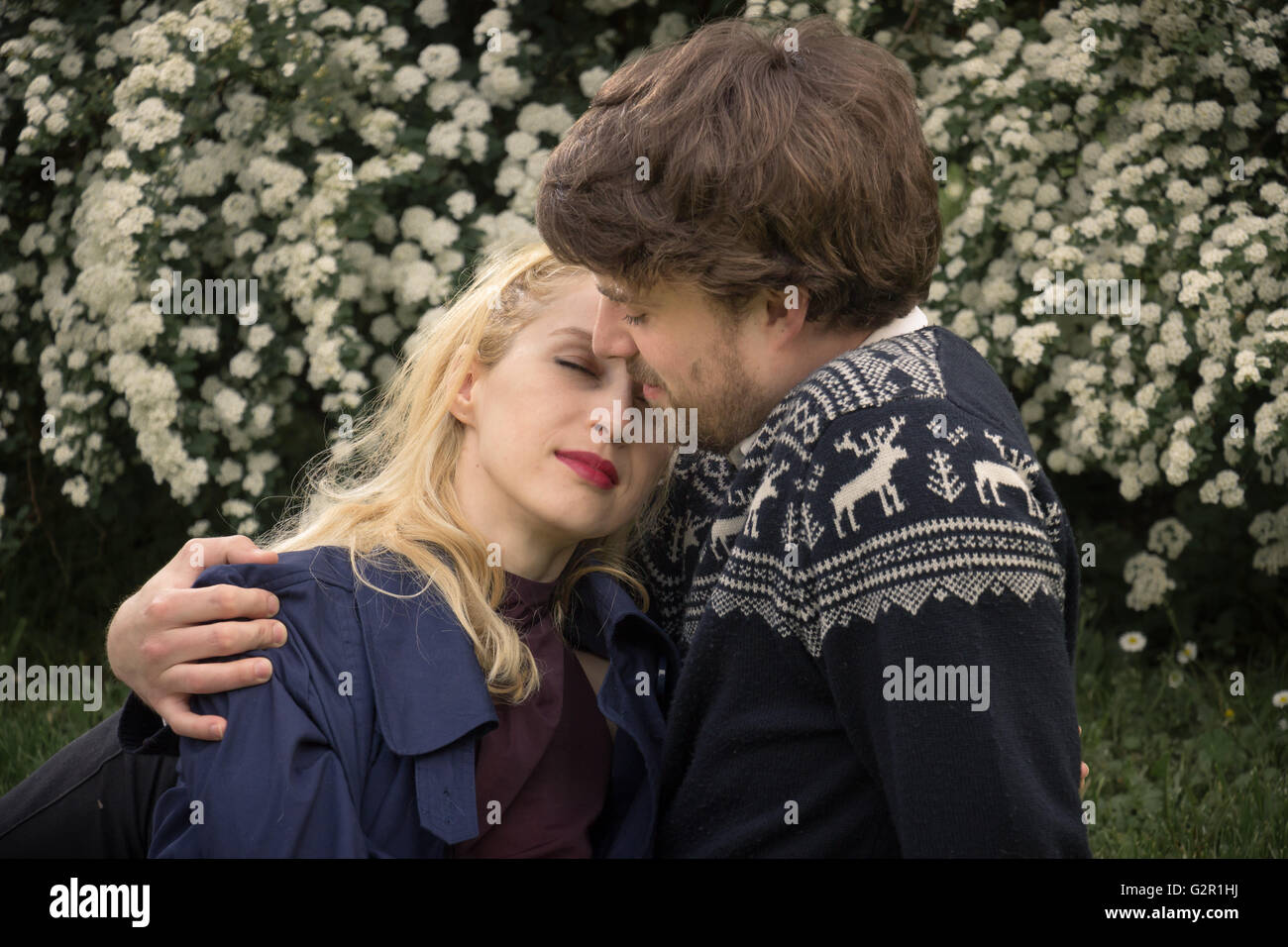 Boy hugging girl, arm Stock Photo - Alamy