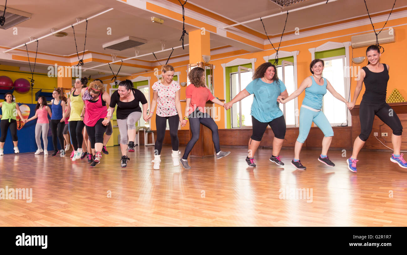Group of girls training indoors, happy Stock Photo - Alamy