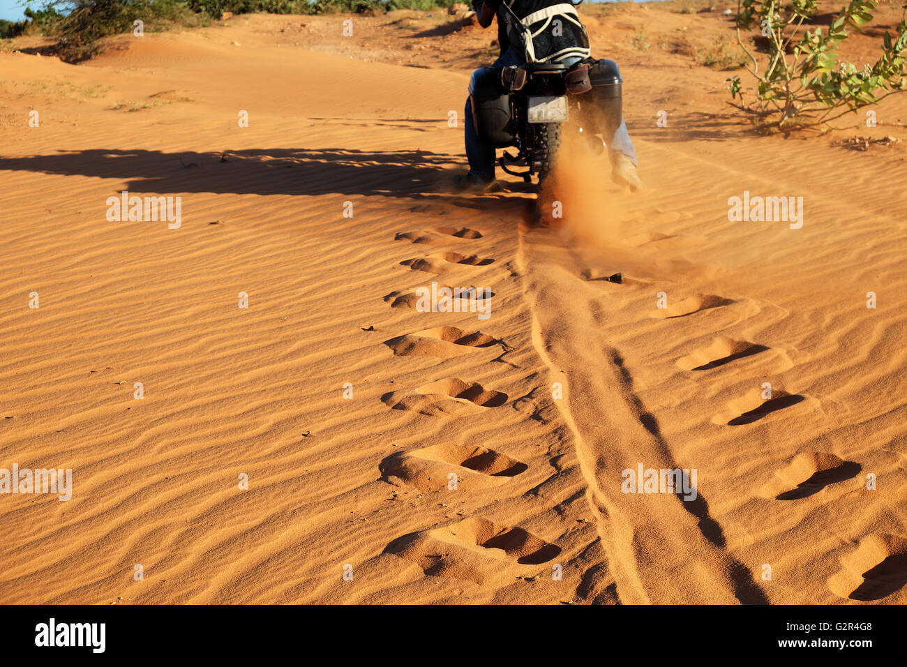 Vietnamese man travel to adventure nature, man ride motorbike on sand ...