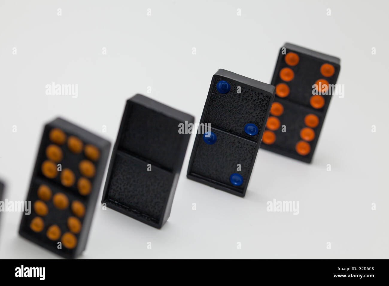 Stack of dominoes isolated on a white background Stock Photo - Alamy