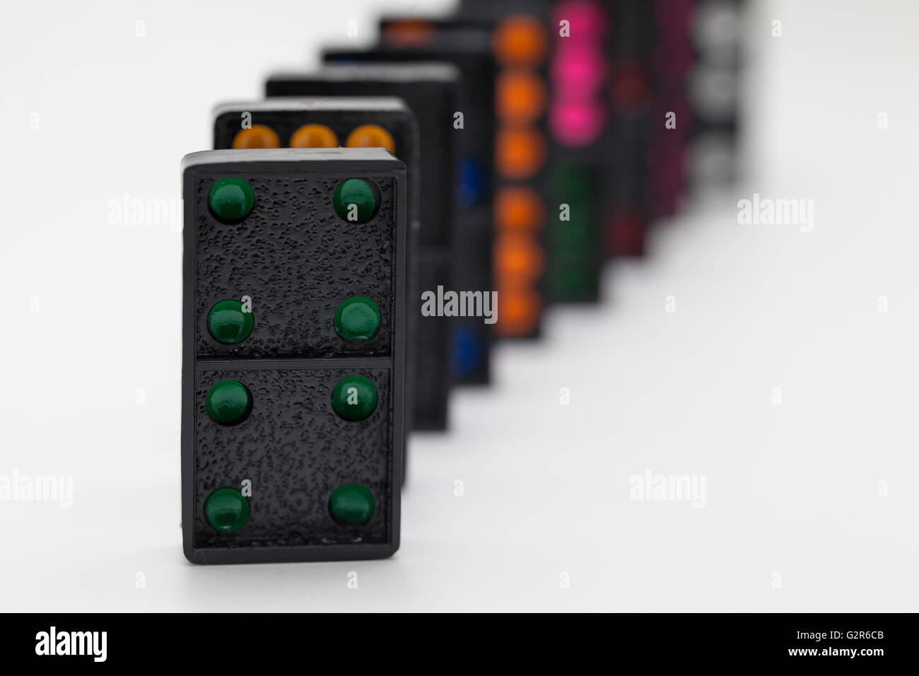 Stack of dominoes isolated on a white background Stock Photo - Alamy