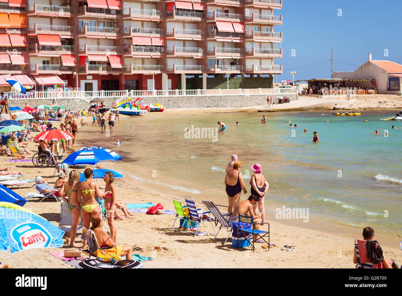 TORREVIEJA, SPAIN - SEPTEMBER 13, 2014: Sunny Mediterranean beach ...