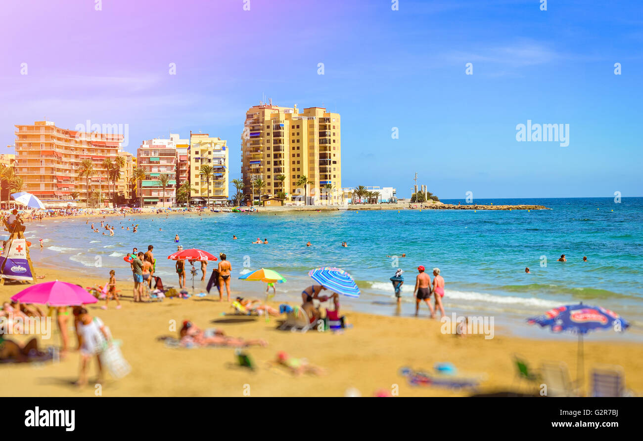 TORREVIEJA, SPAIN - SEPTEMBER 13, 2014: Sunny Mediterranean beach ...