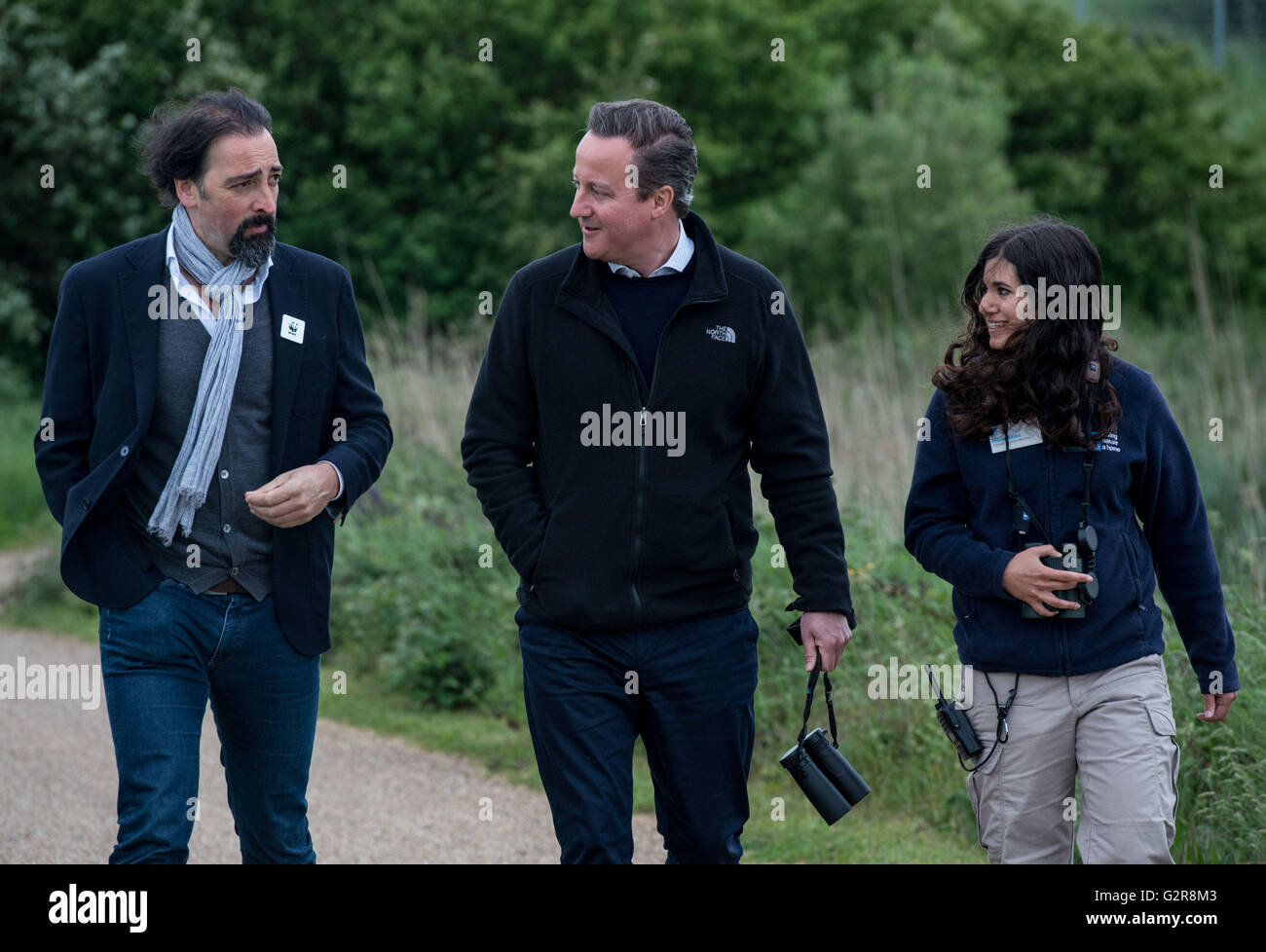 Prime Minister David Cameron (centre) is shown around RSPB nature ...