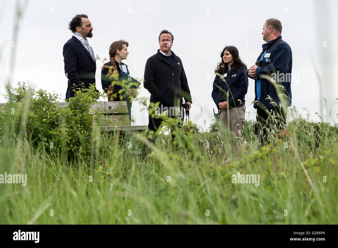 Prime Minister David Cameron (centre) is shown around RSPB nature ...