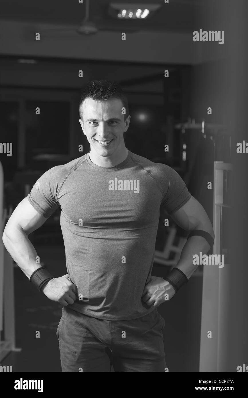 Portrait fit man crossed arms Black and White Stock Photos & Images - Alamy