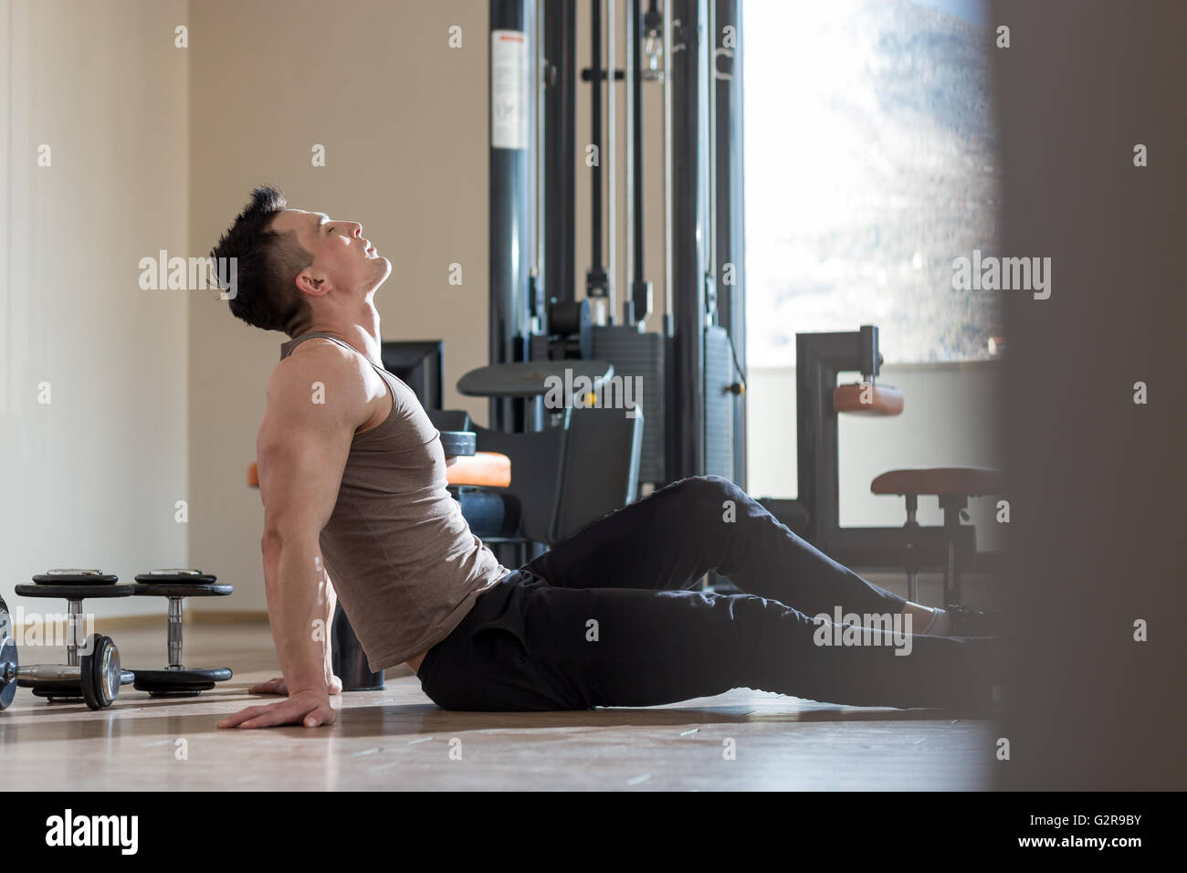 Muscular Man Resting After Exercise Stock Photo - Alamy