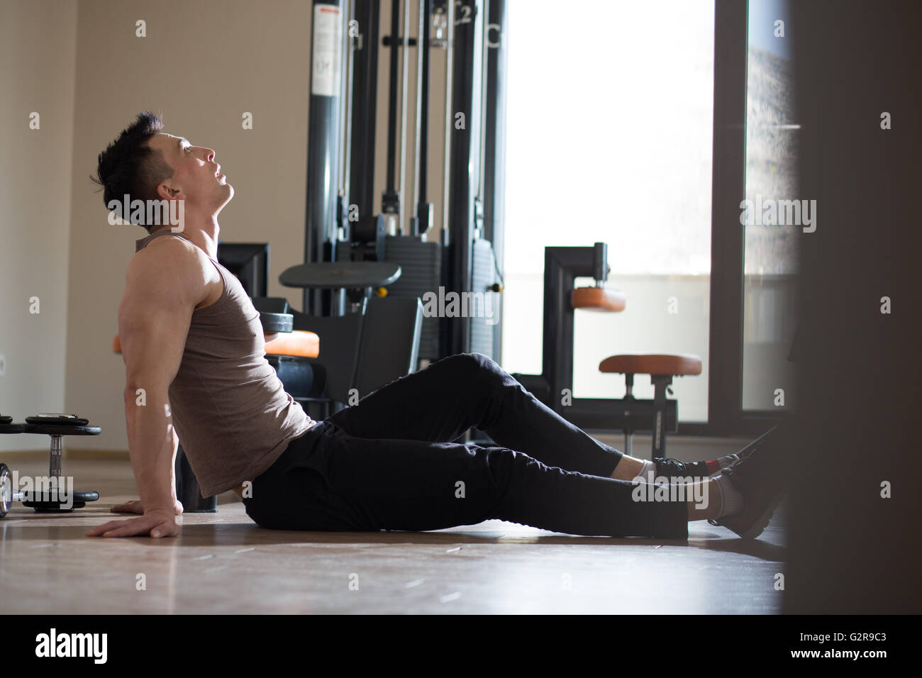 Muscular Man Resting After Exercise Stock Photo - Alamy