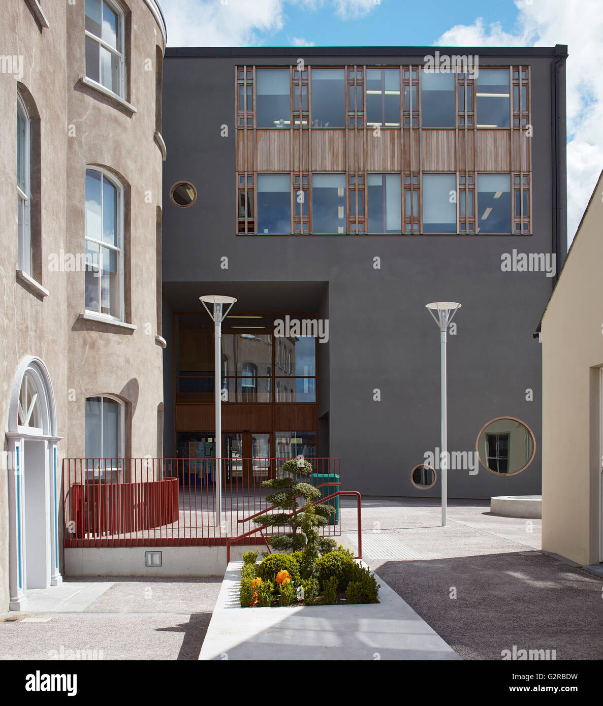 Juxtaposition of existing historic facade and new building in main ...