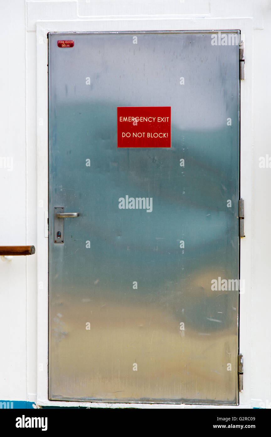 Emergency exit door and sign on a cruise ship Stock Photo - Alamy