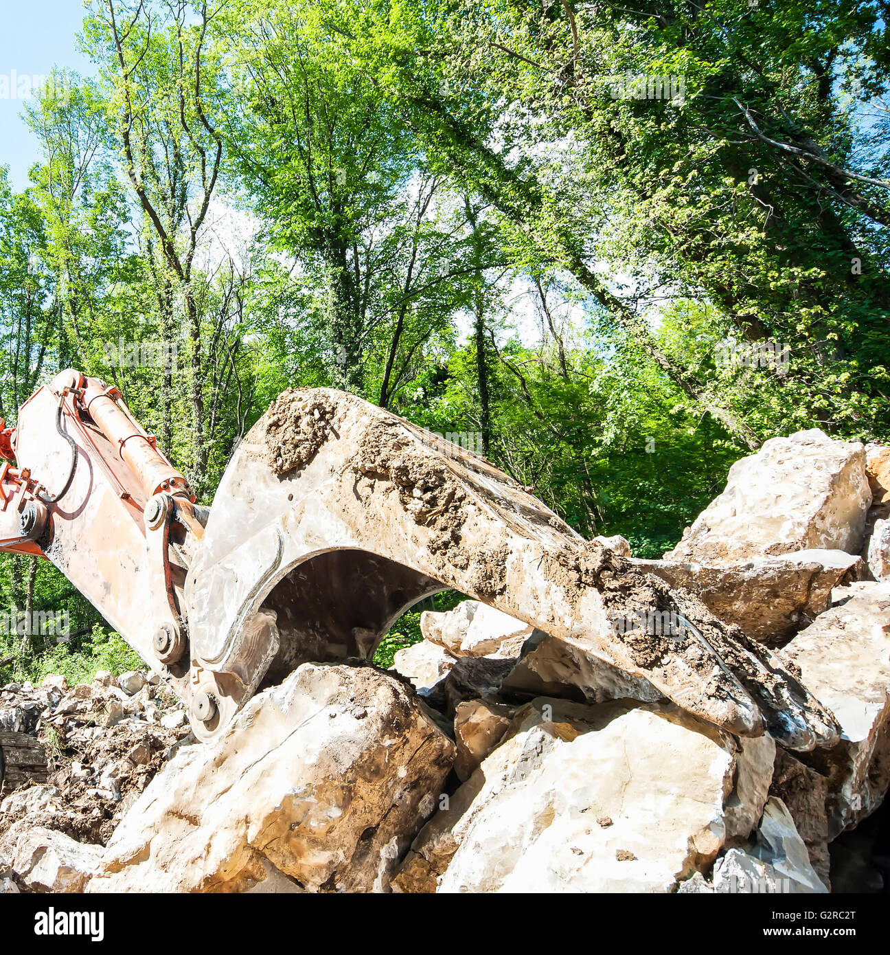 Excavator with big shovel to work with rocks Stock Photo - Alamy
