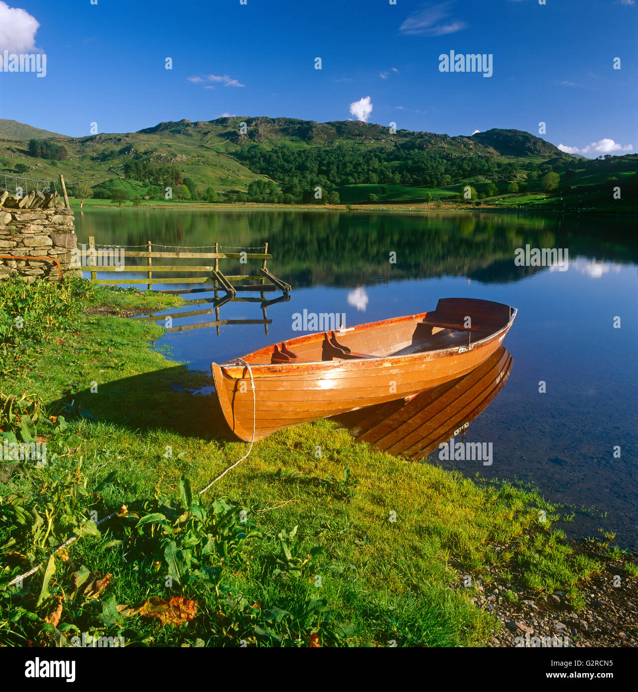 A rowing boat docked up, outside Stock Photo - Alamy