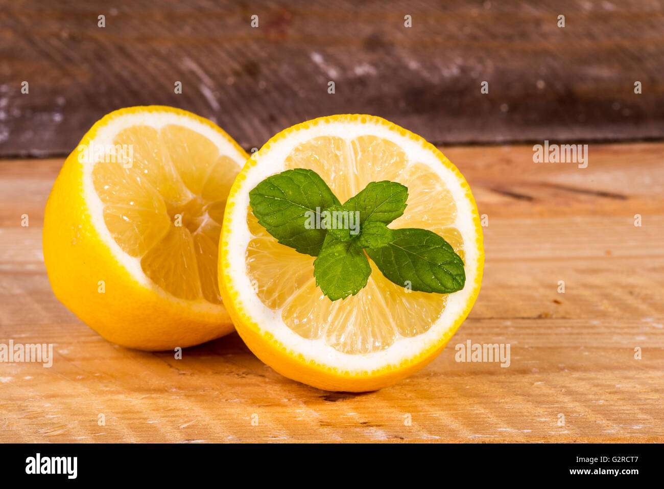 photo of half a lemon with fresh mint Stock Photo - Alamy