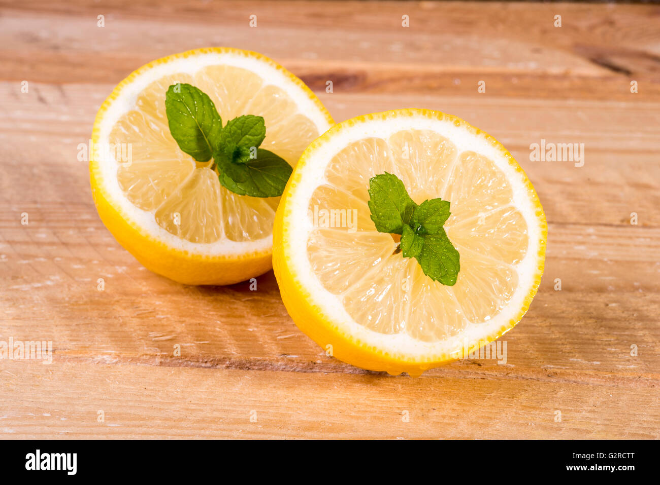 photo of half a lemon with fresh mint Stock Photo - Alamy