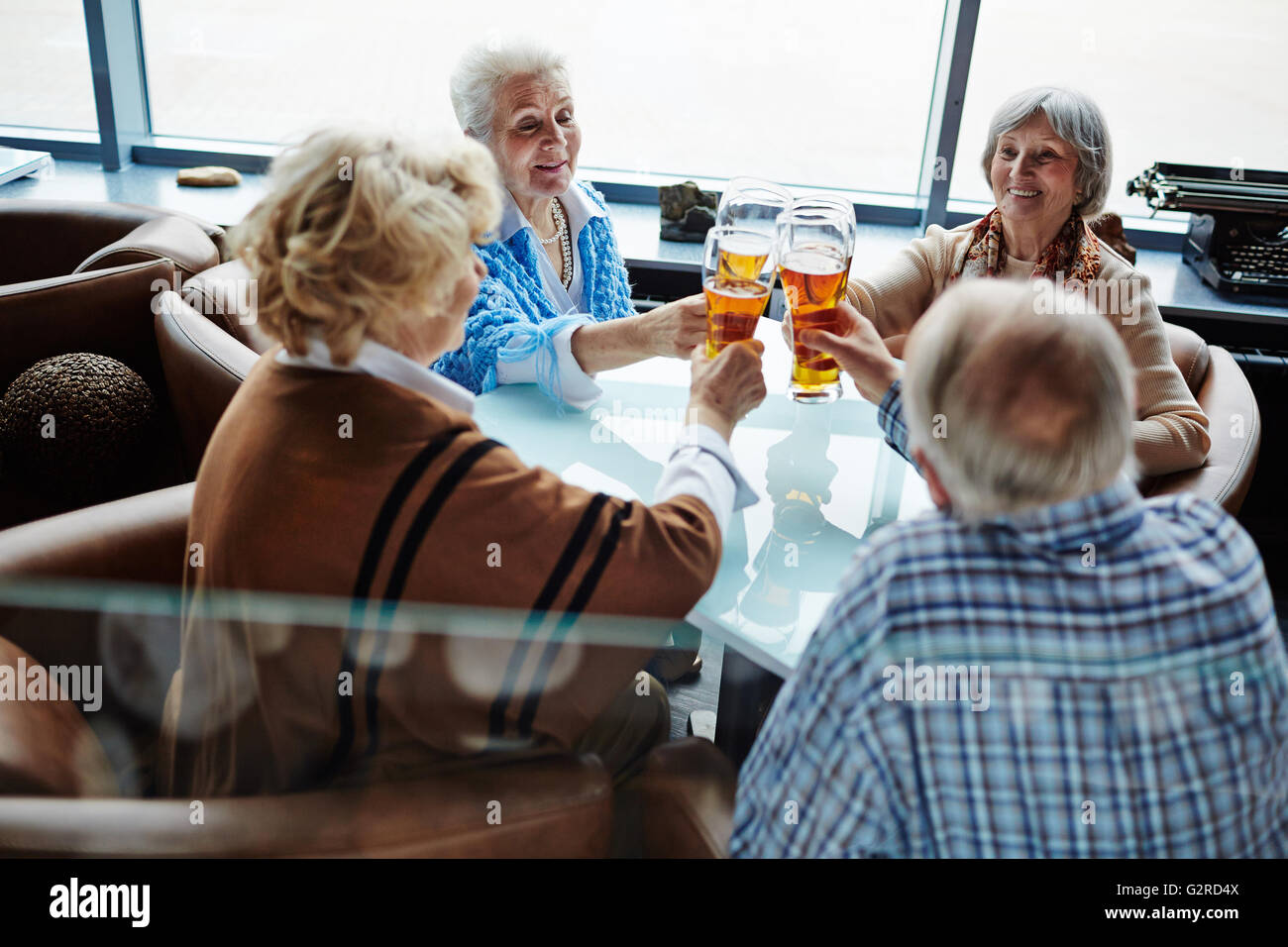 Seniors having beer in pub Stock Photo - Alamy