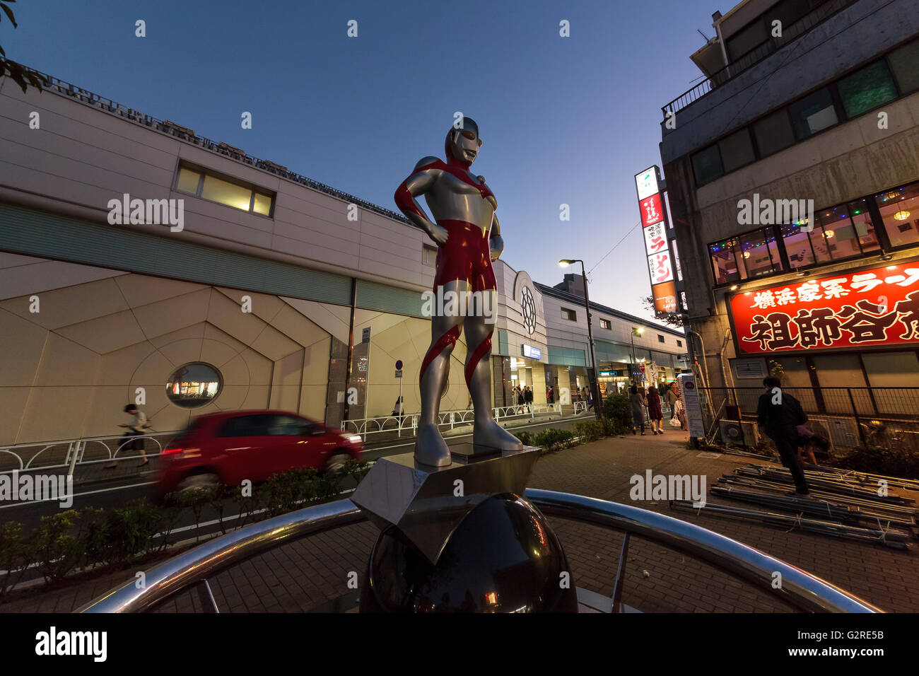 A statue of Ultraman stands guard near the train station in Soshigaya ...