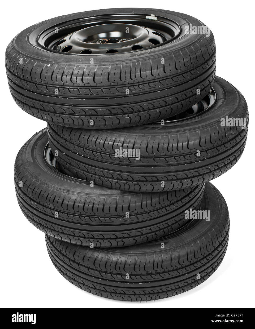 Stack of four wheel black tyres for summer Stock Photo - Alamy
