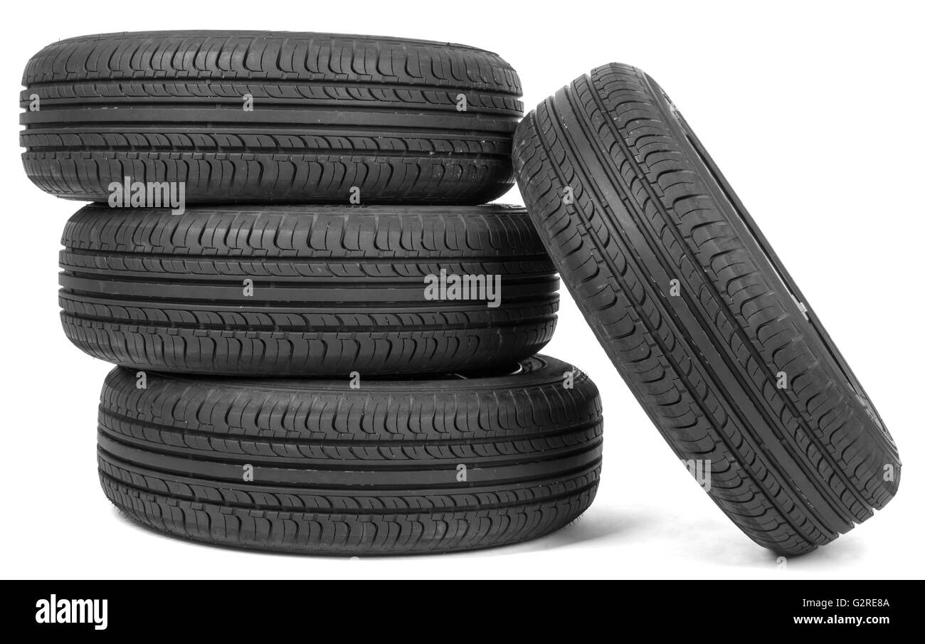 Stack of four wheel new black tyres Stock Photo - Alamy