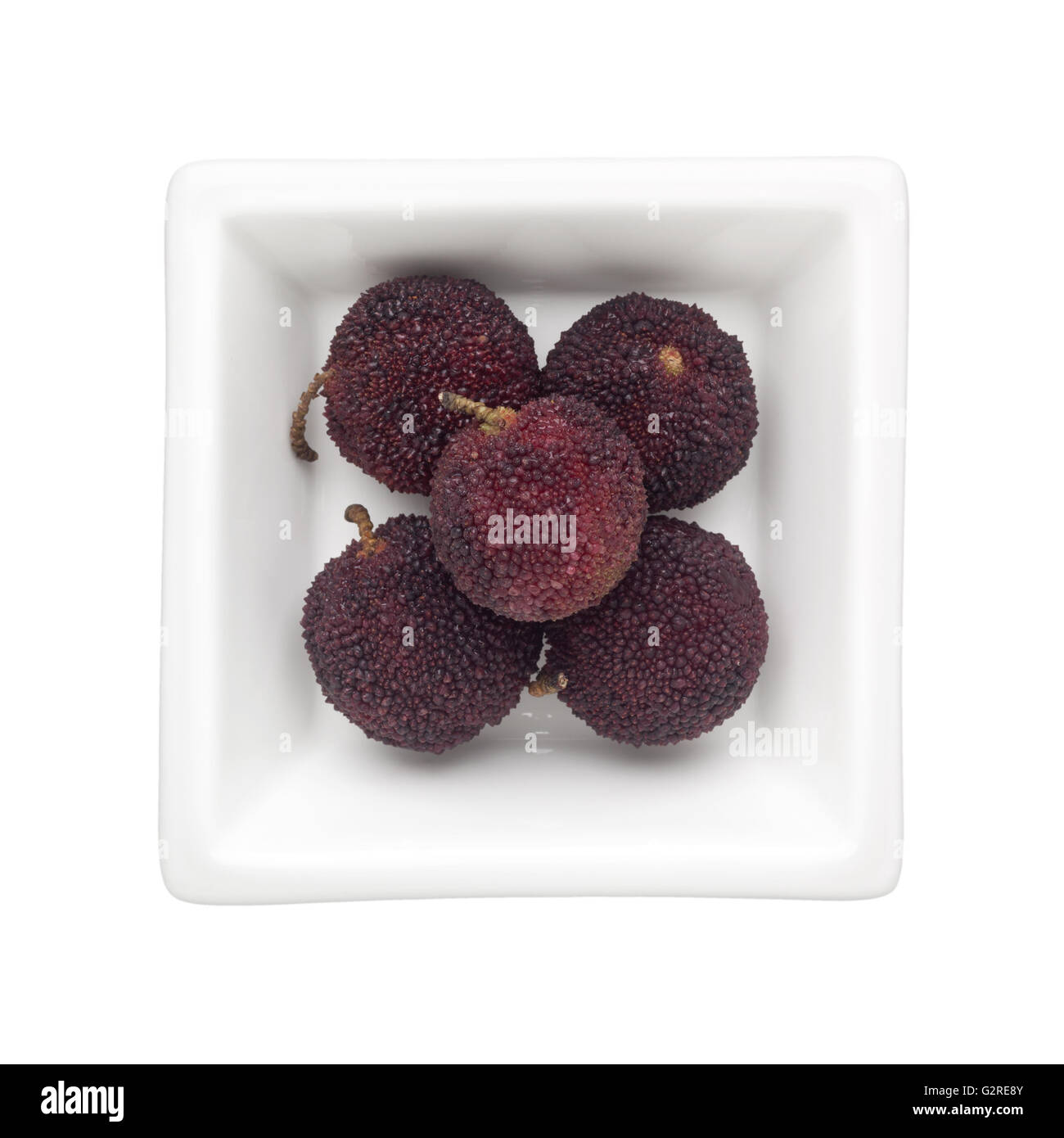 Yumberries in a square bowl isolated on white background Stock Photo ...