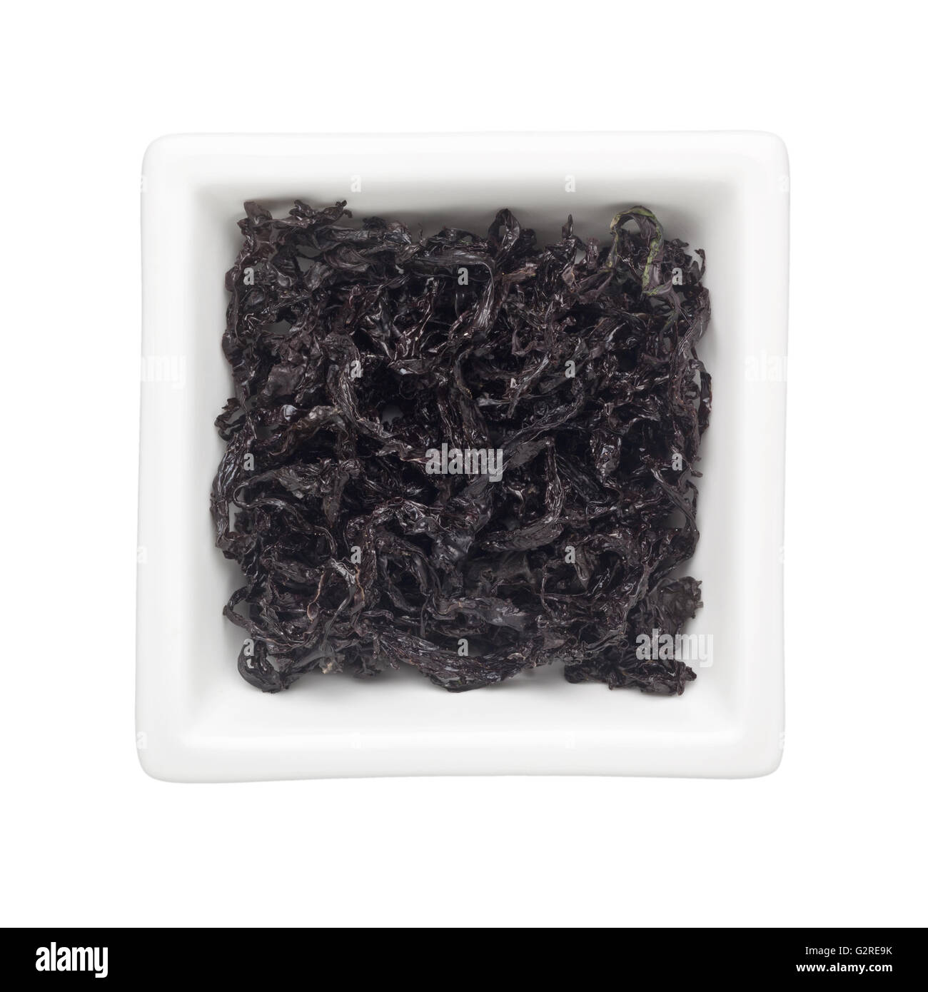 Black moss in a square bowl isolated on white background Stock Photo ...