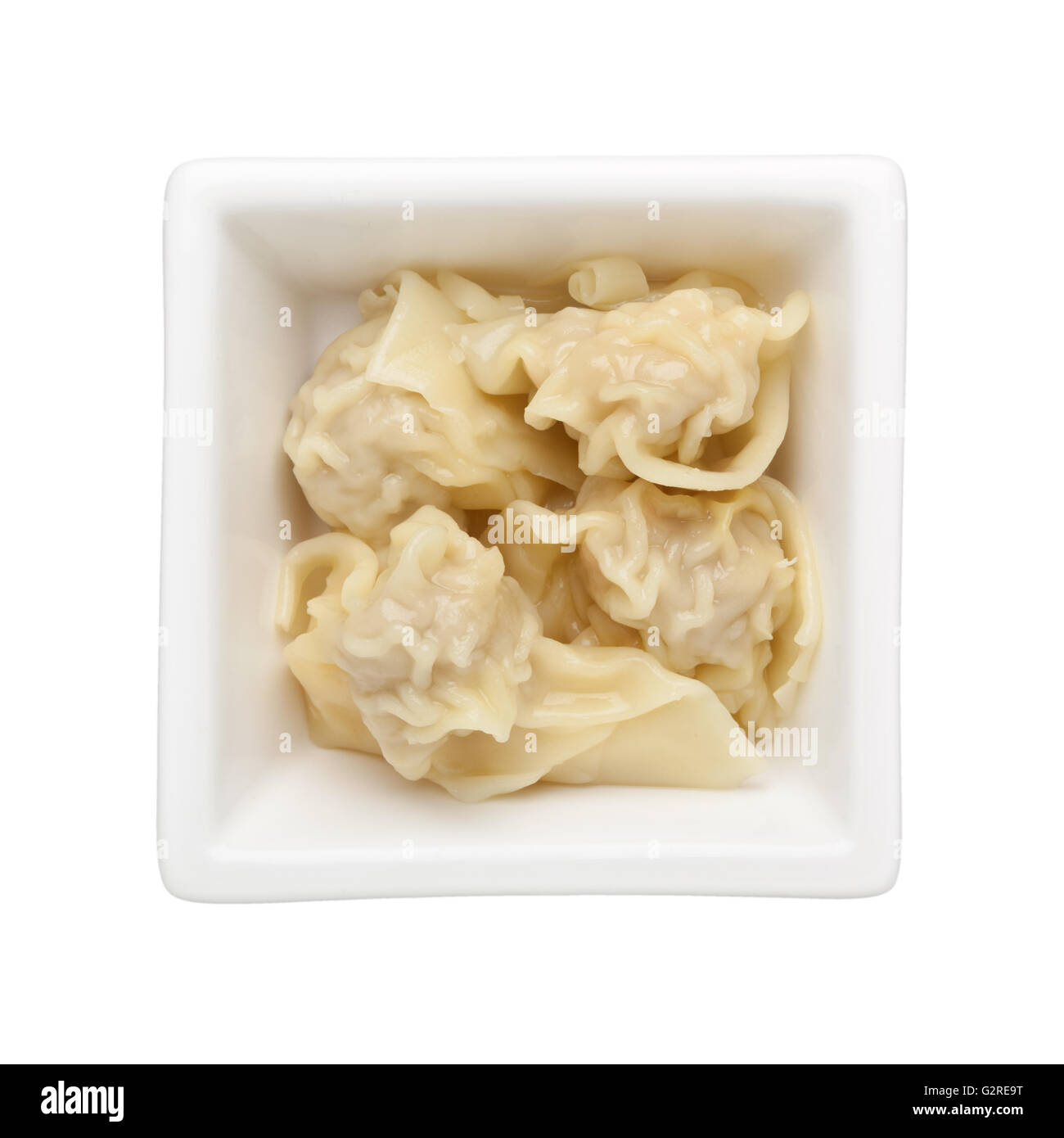 Wonton dumplings in a square bowl isolated on white background Stock ...