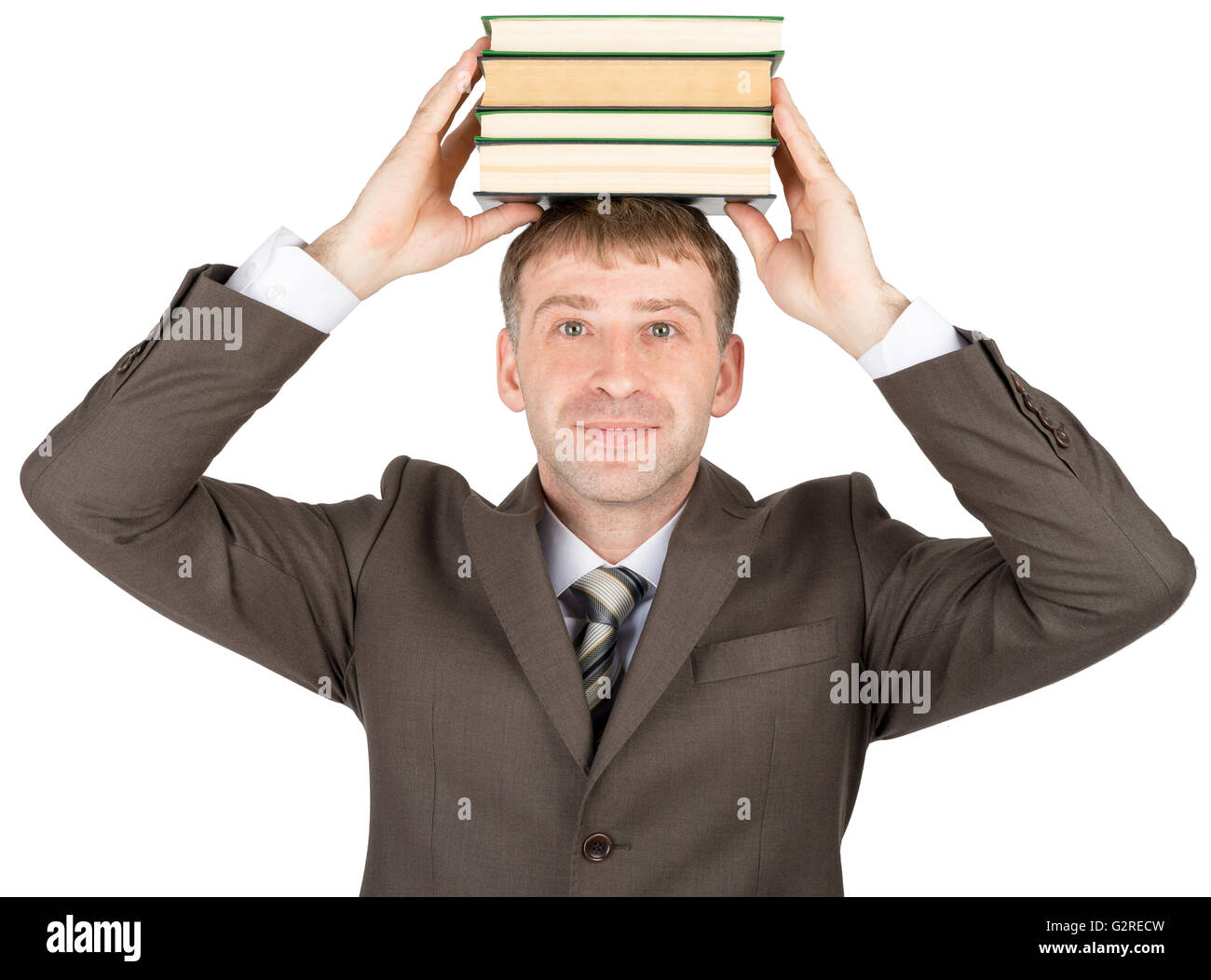 Young man holding stack of books Stock Photo - Alamy