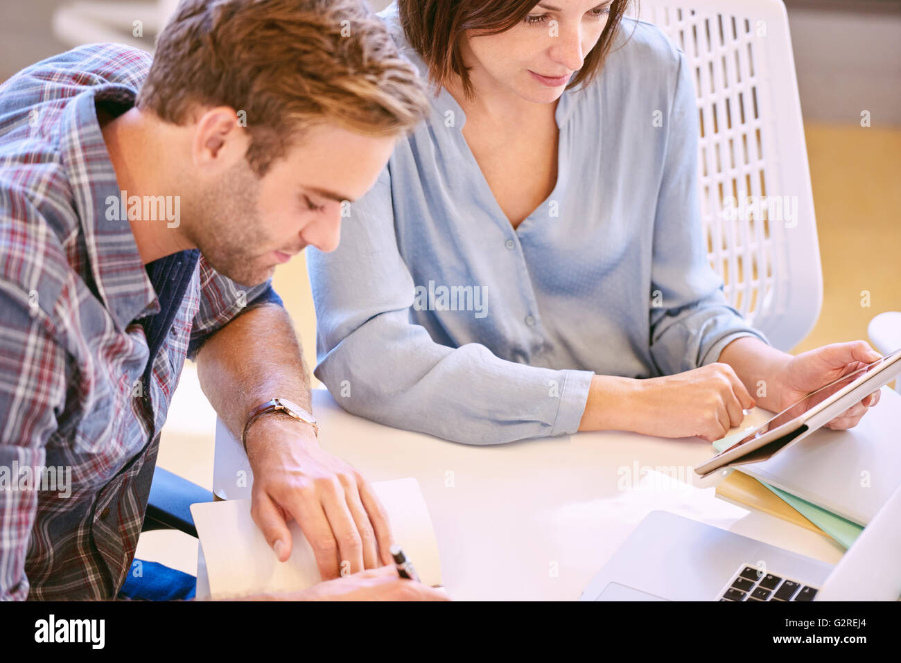 close up of man and woman working well together Stock Photo - Alamy