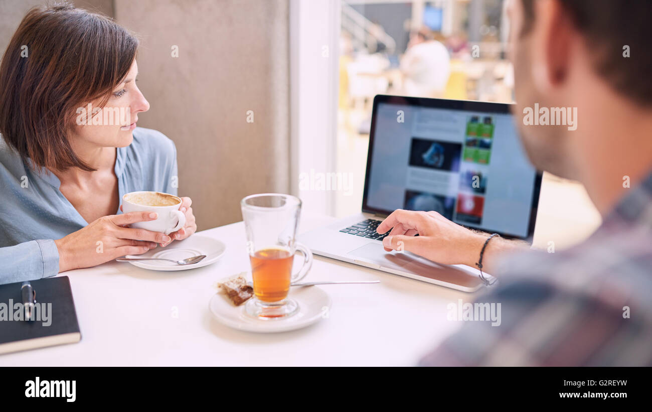 Laptop over the shoulder hi-res stock photography and images - Alamy