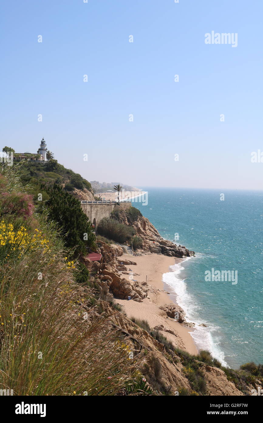 A view along the beaches of Calella with the famed lighthouse - Far de ...