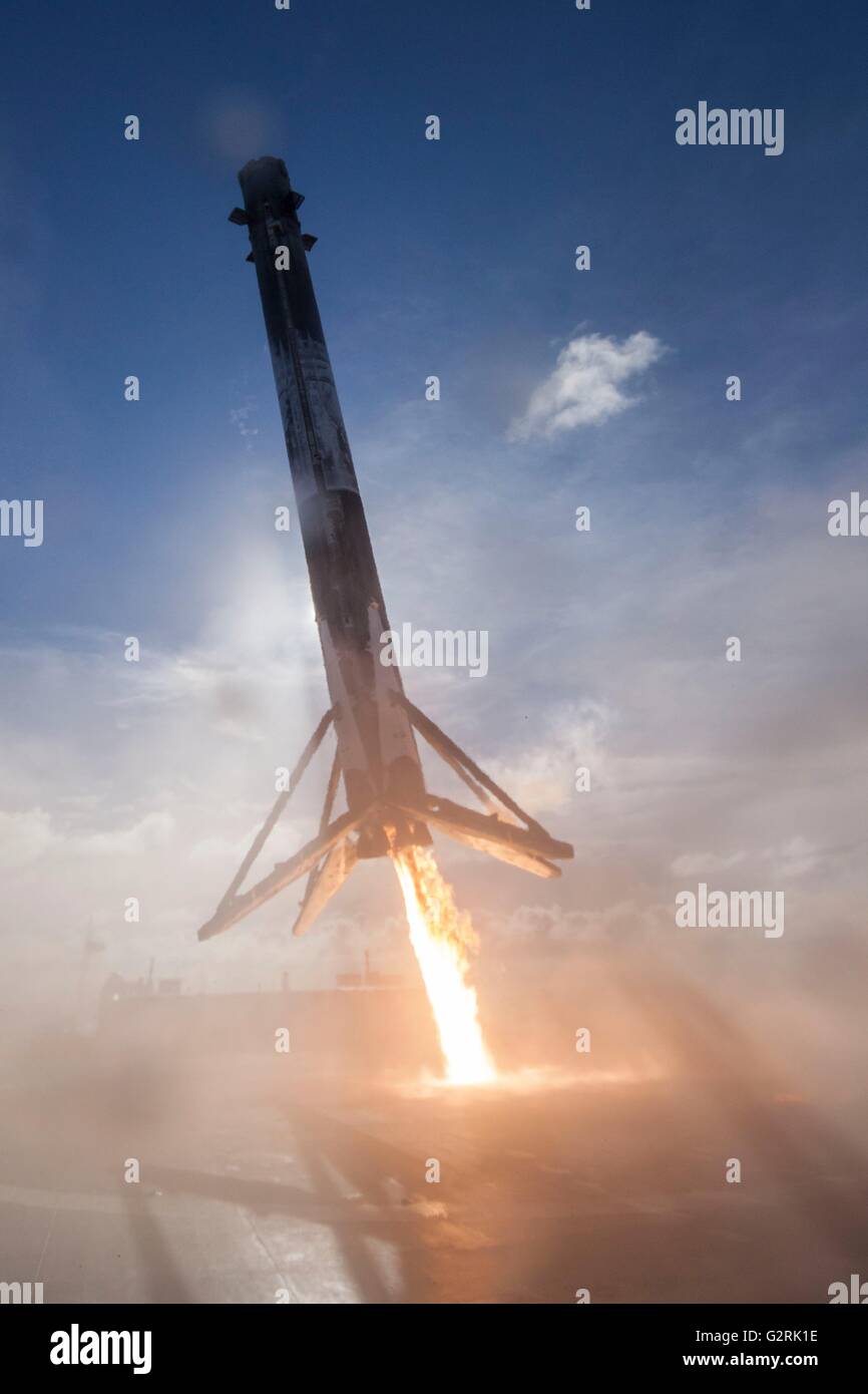 The SpaceX Falcon 9 reusable launch vehicle fires booster rockets as it ...