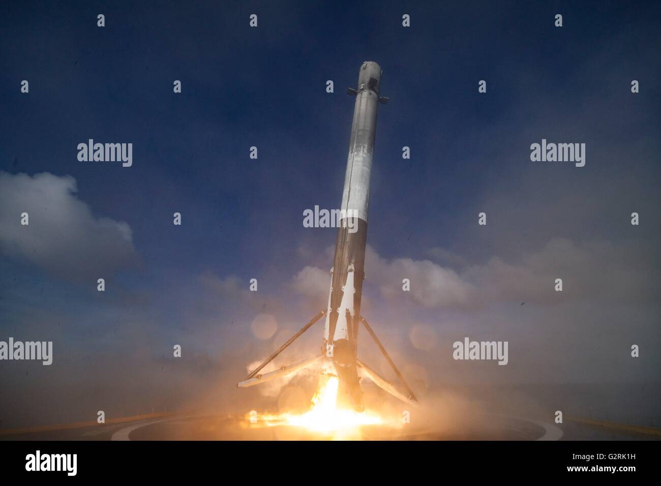 The SpaceX Falcon 9 reusable launch vehicle fires booster rockets as it ...