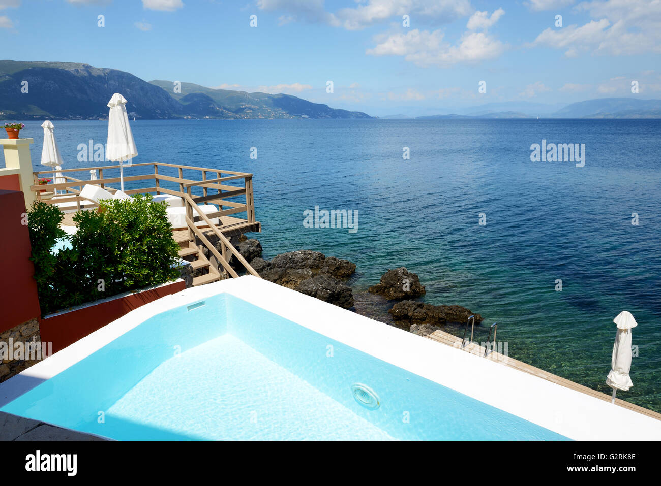 The swimming pool near beach at luxury hotel, Corfu, Greece Stock Photo ...