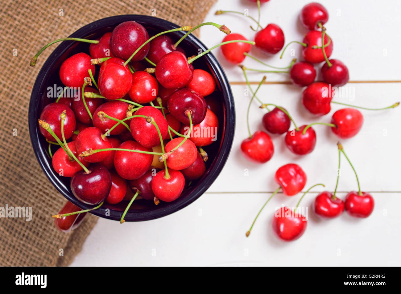Fresh cherries on wooden table Stock Photo - Alamy