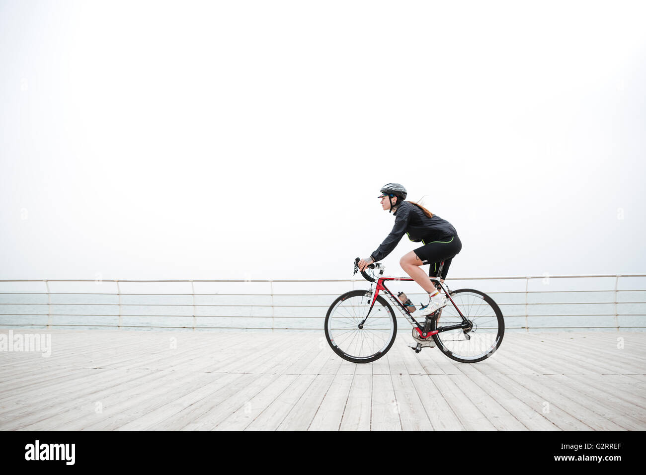 Lady riding her bicycle hi-res stock photography and images - Alamy